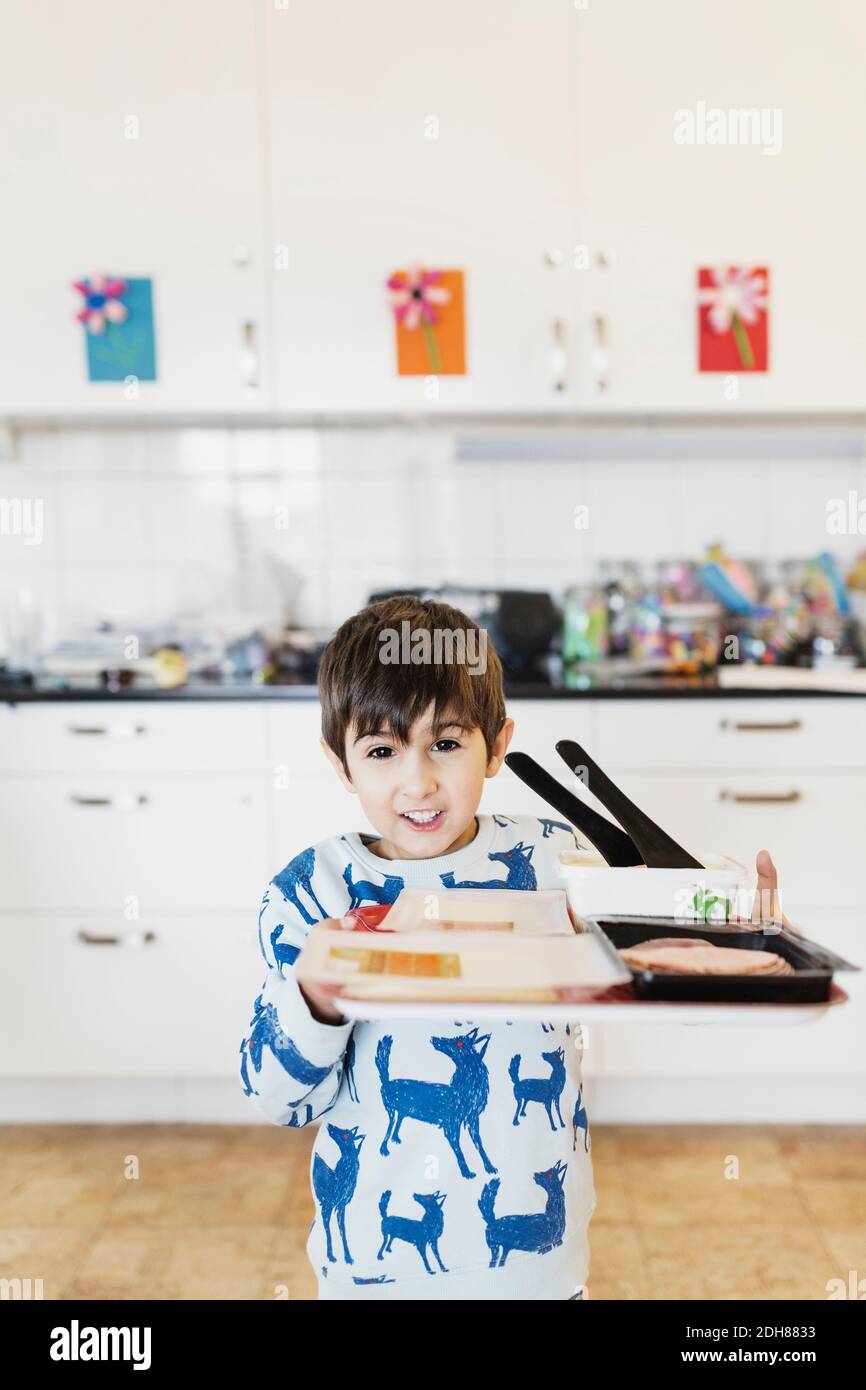 Standing carrying childhood food and drink hi-res stock photography and ...