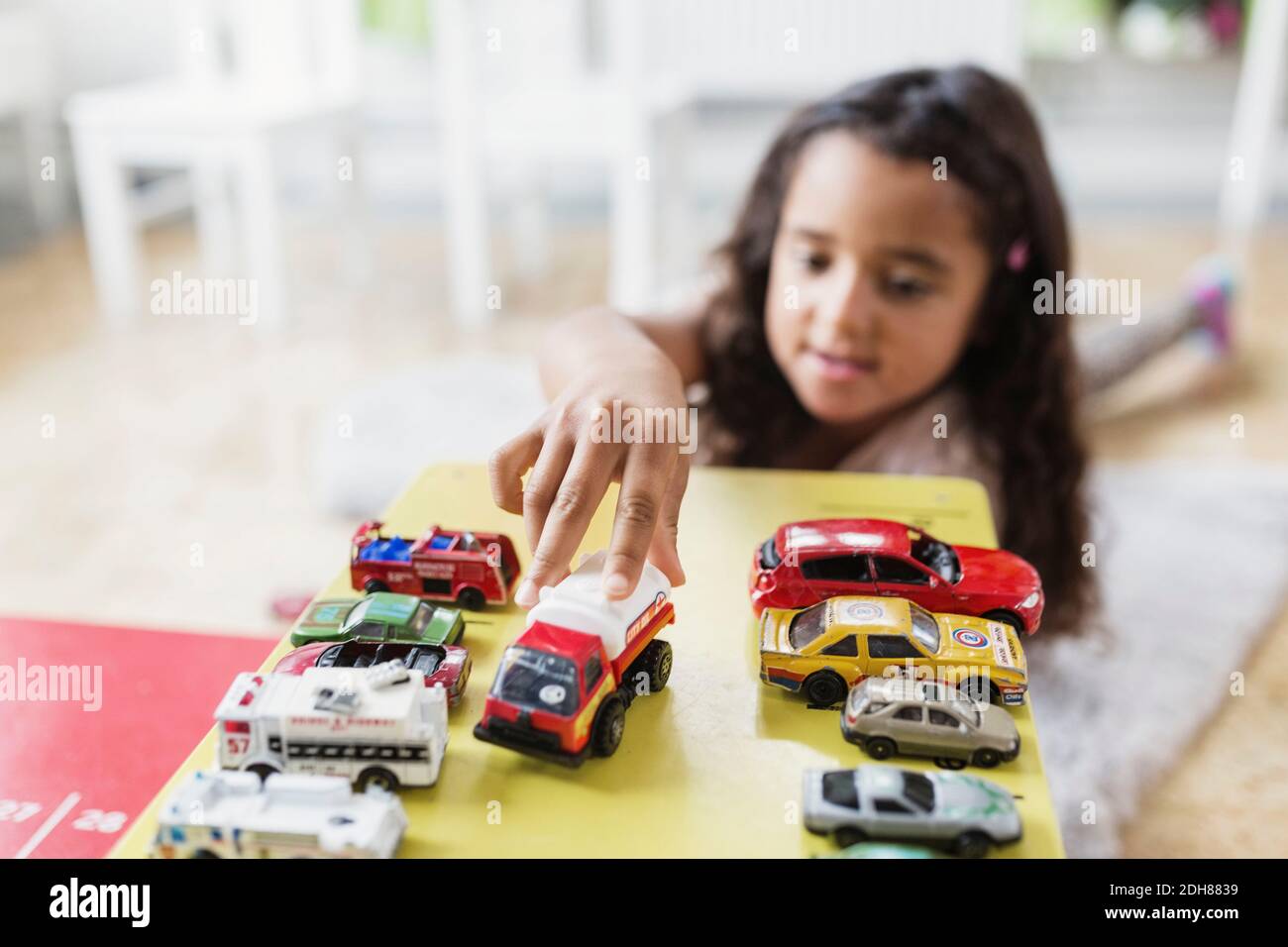 Girl with toy truck hi-res stock photography and images - Alamy