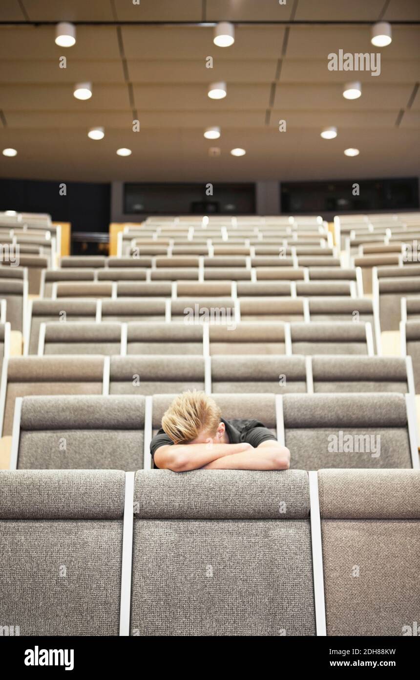 Man sitting on a chair with his arms crossed hi-res stock photography ...