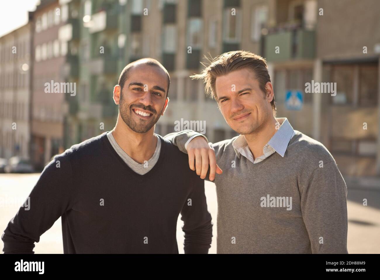 Portrait of mid adult male friends enjoying together outdoors Stock ...