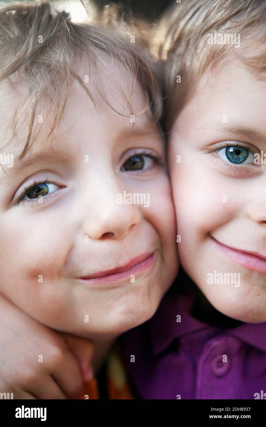 Close-up portrait of a two brothers smiling Stock Photo - Alamy