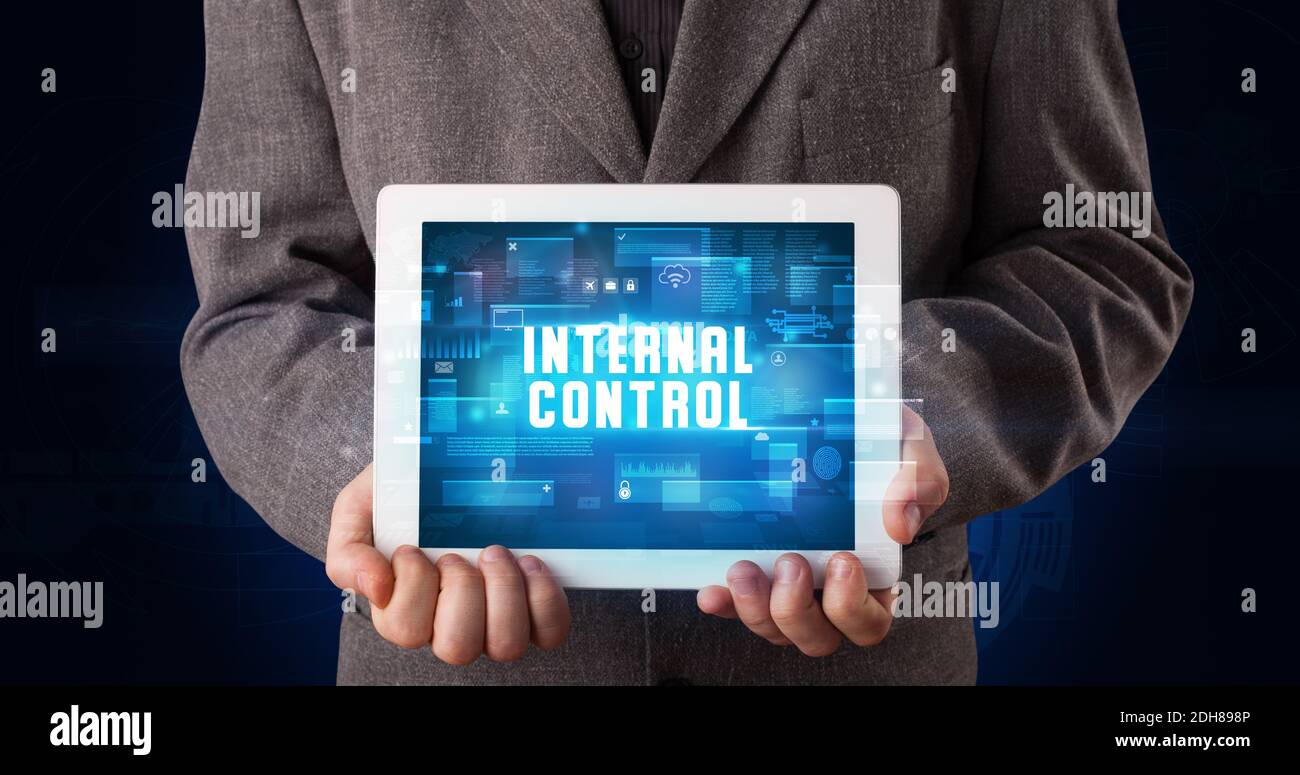 Young business person working on tablet and shows the digital sign ...