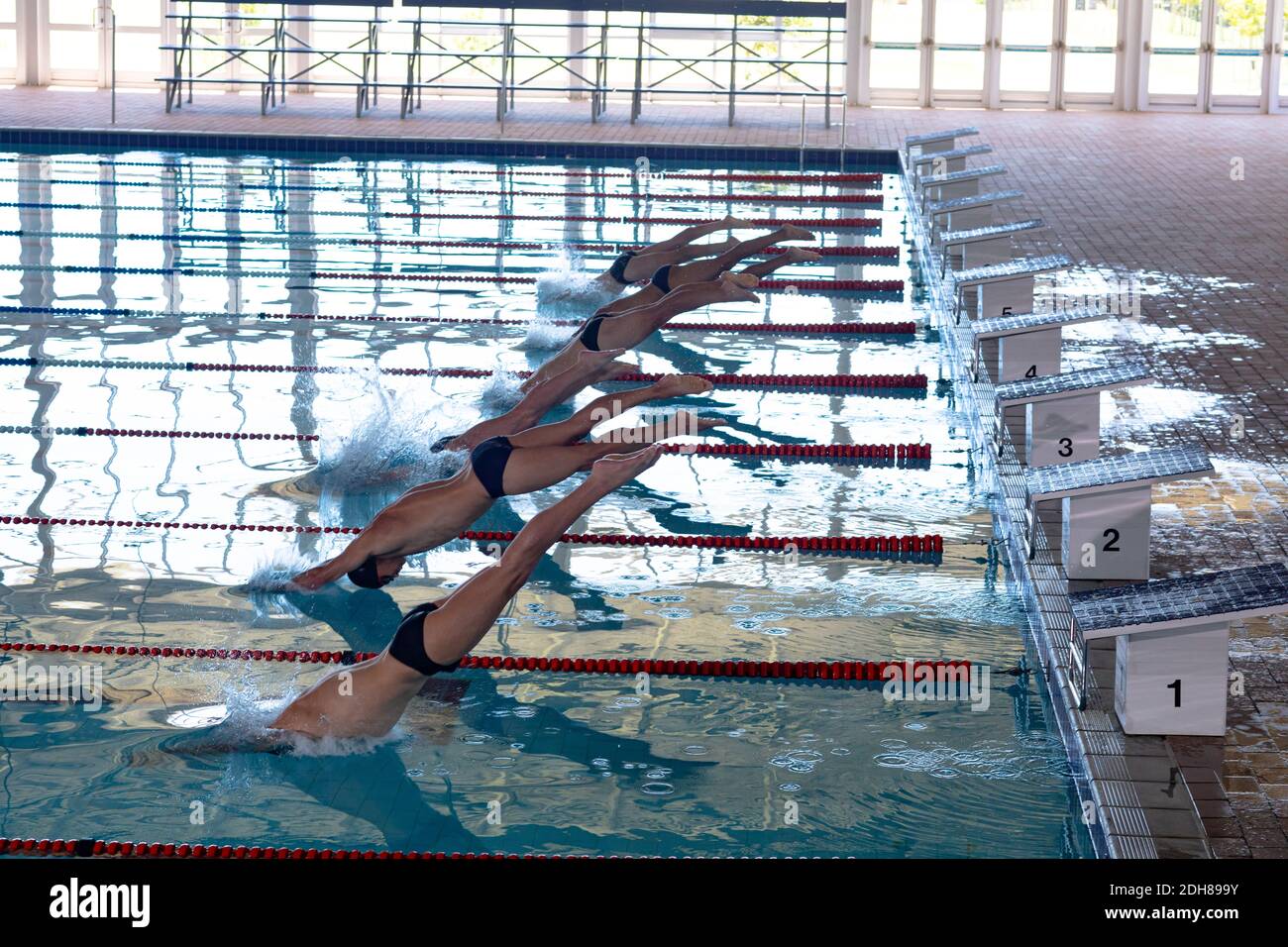 Swimmers plunging in the pool Stock Photo - Alamy
