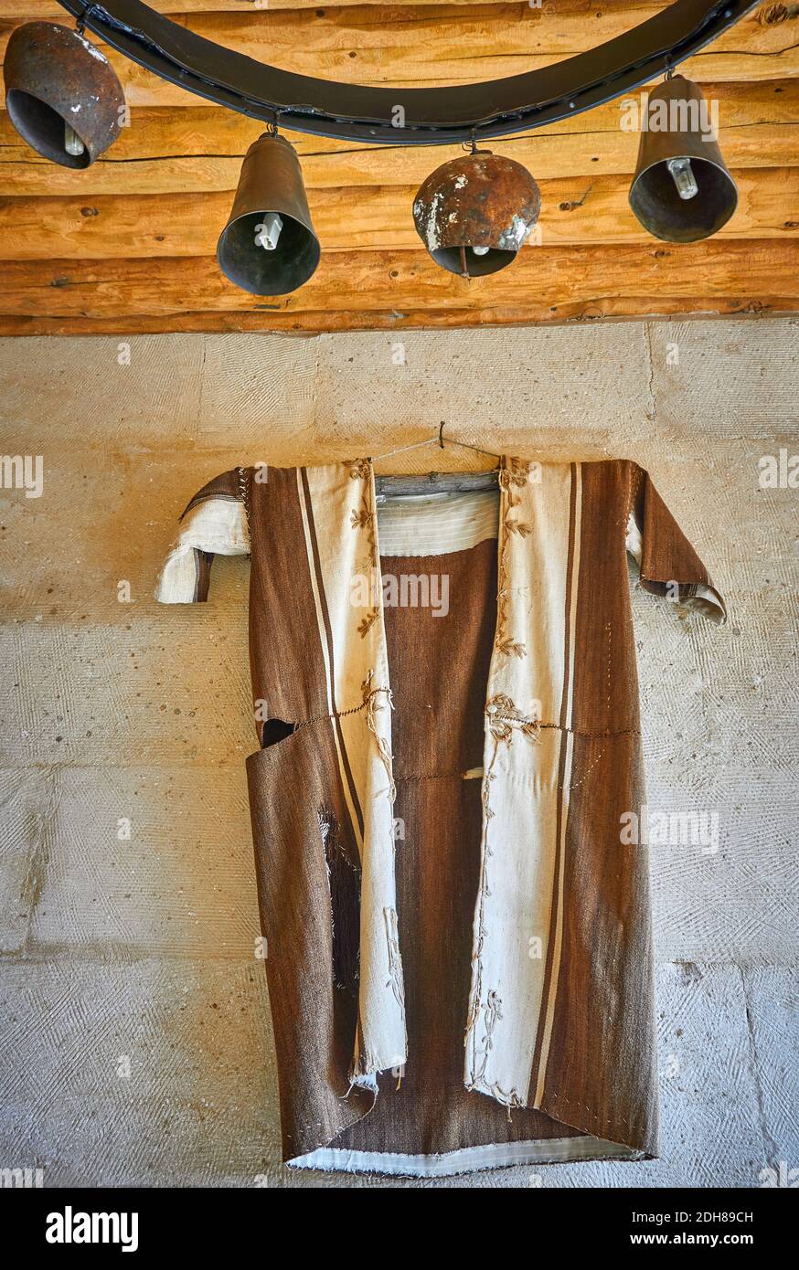 Traditional and old shepherd dress on the wall Stock Photo - Alamy