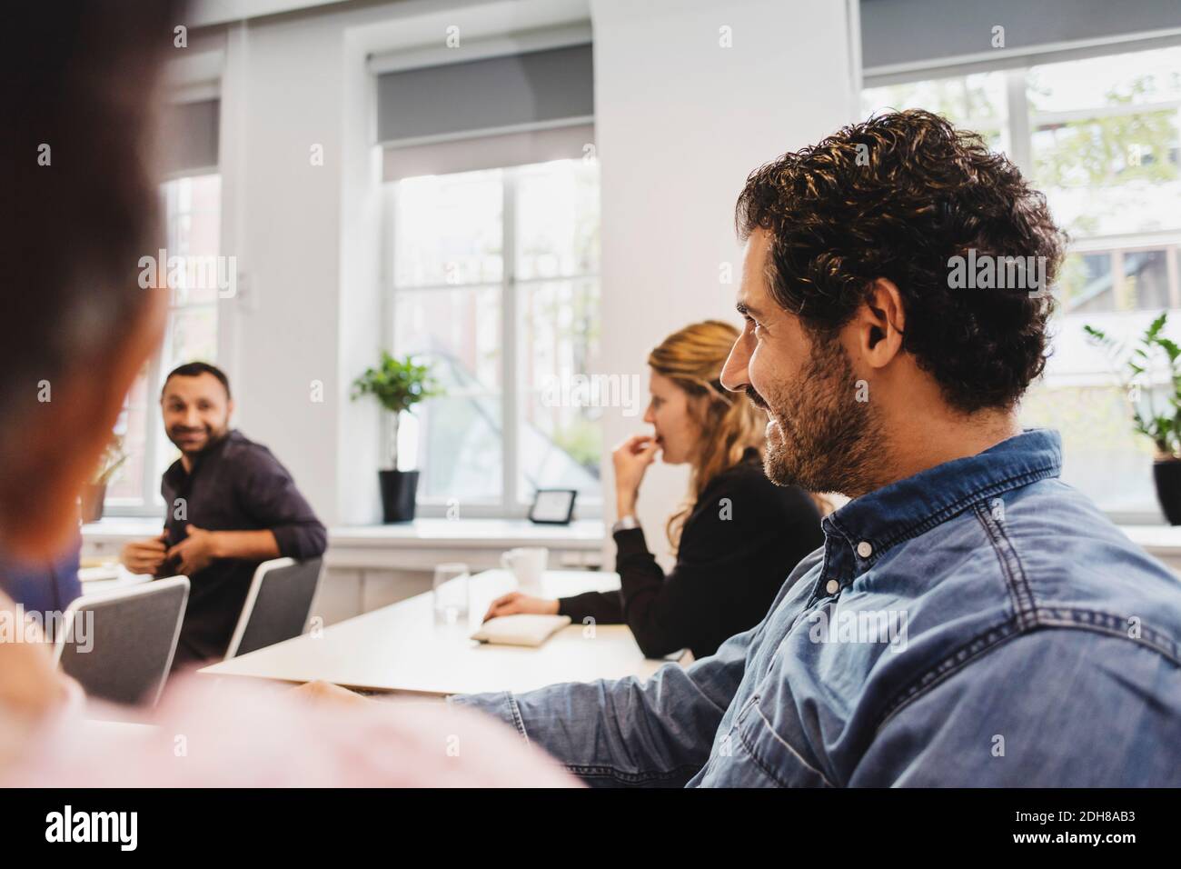 Smiling multi-ethnic students sitting in language class Stock Photo - Alamy Smiling multi-ethnic students sitting in language class Stock Photo - Alamy