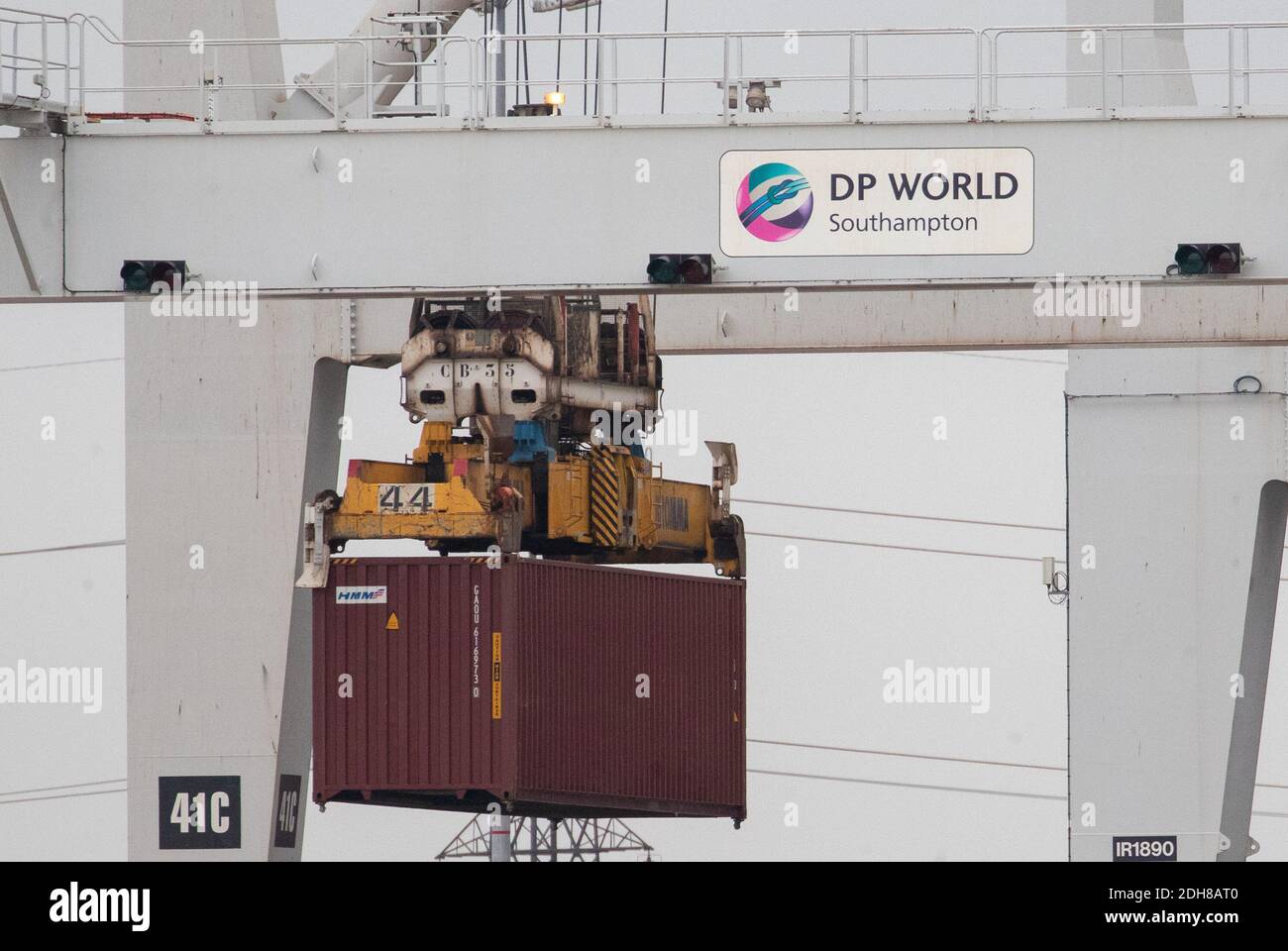 Containers are unloaded from the container ship MOL Treasure whilst at ...