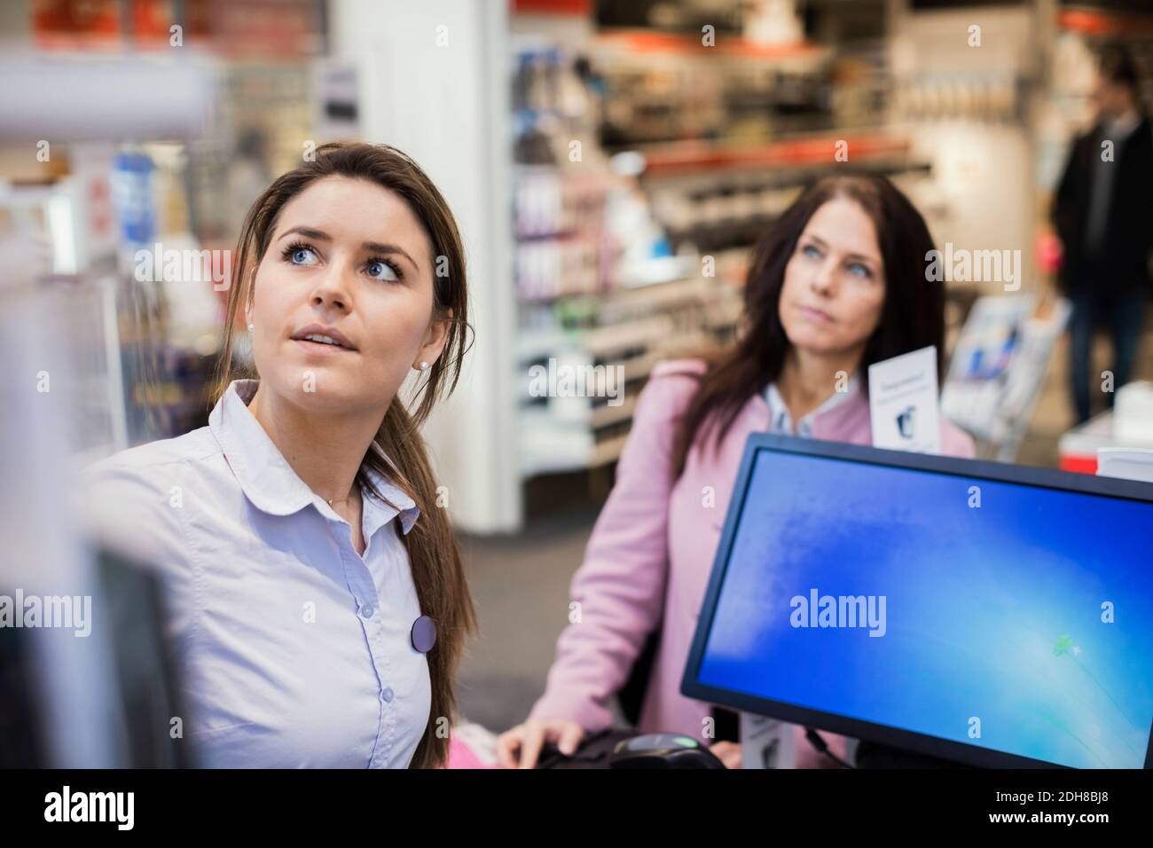 Female cash counter hi-res stock photography and images - Alamy