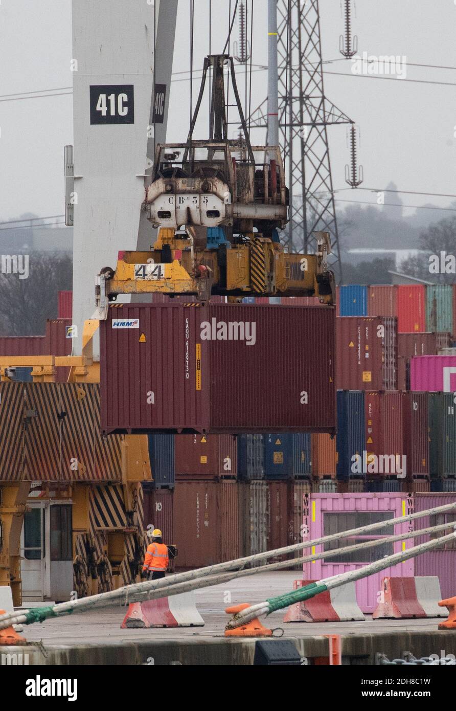 Containers are unloaded from the container ship MOL Treasure whilst at ...