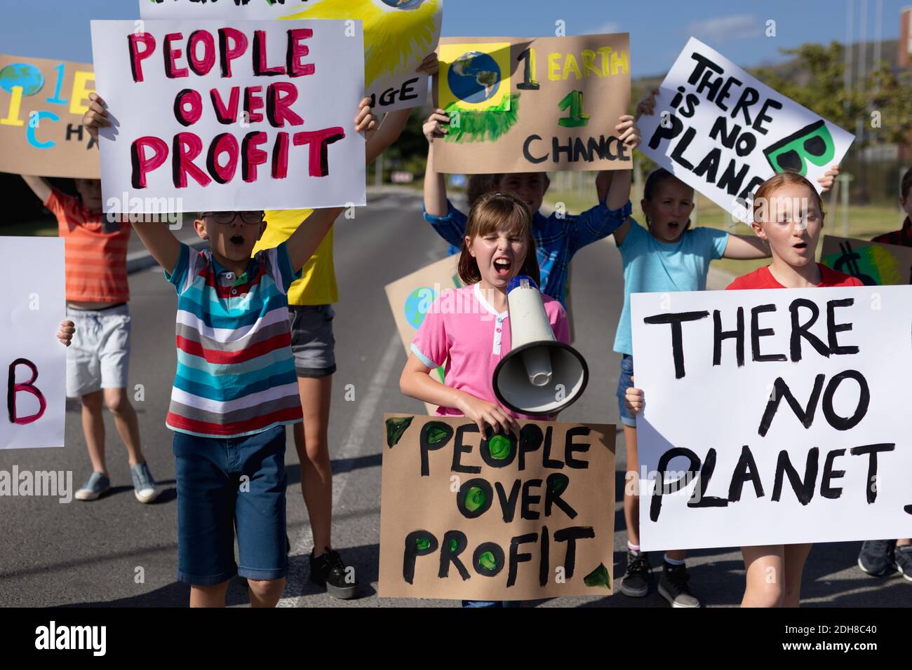 Group of elementary school pupils walking on a protest march Stock ...