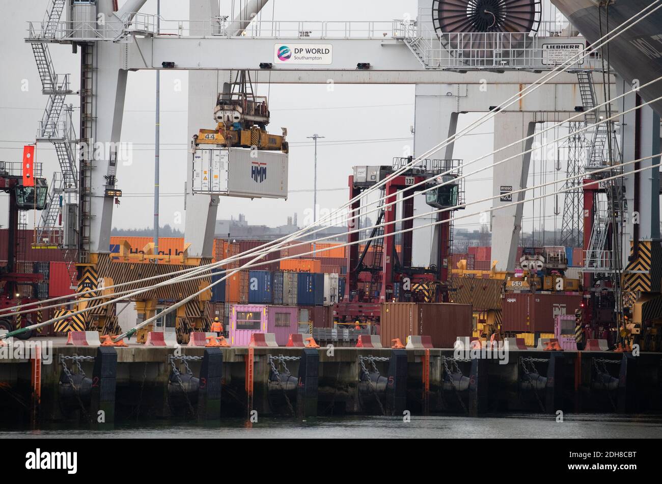 Containers are unloaded from the container ship MOL Treasure whilst at ...