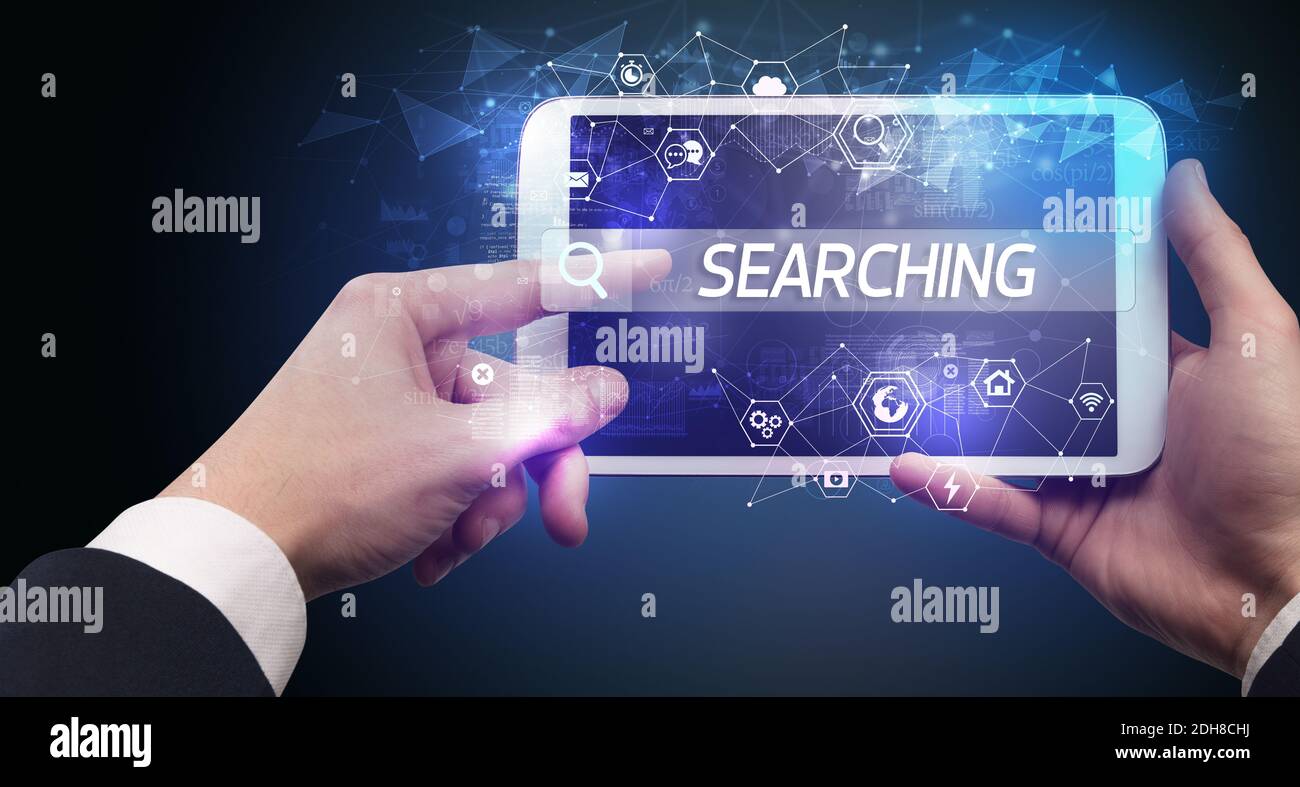 Close-up of a tablet searching GAMING inscription, hi-tech computing ...