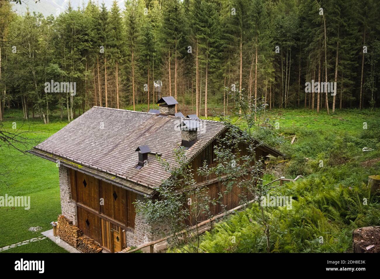 A mountain hut made of stone and wood in the Italian Alps (Trentino ...
