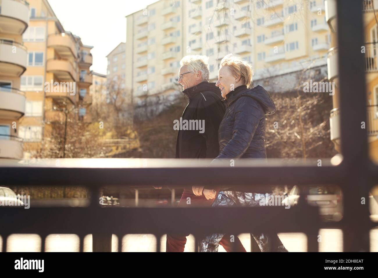 Couple walking side profile hi-res stock photography and images - Alamy