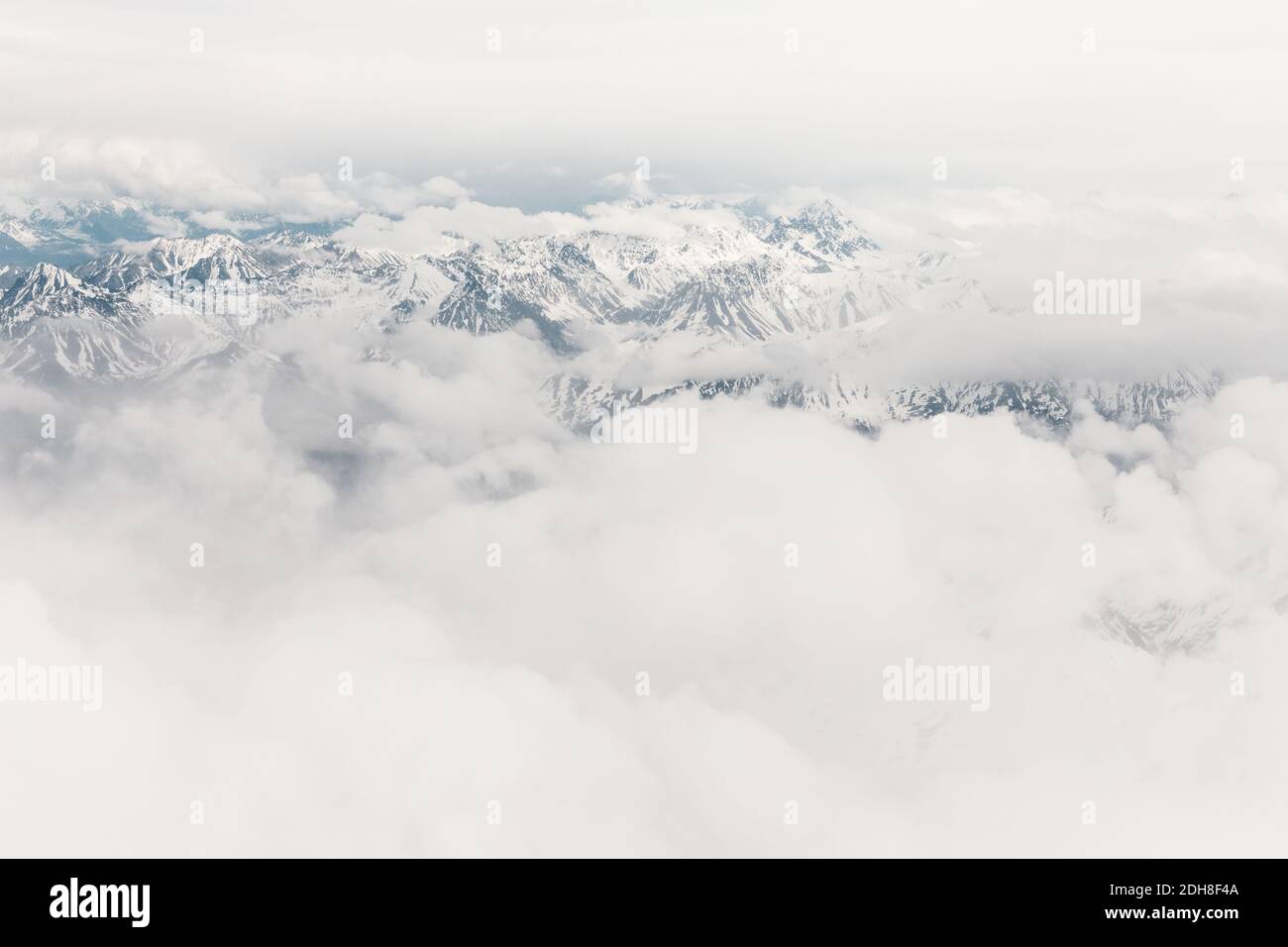 An aerial view of mountain tops and glaciers of Harriman Fiord, Alaska ...