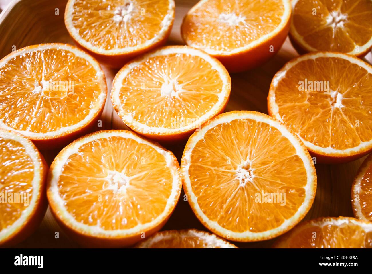 Bunch of fresh sliced oranges on a tray Stock Photo - Alamy