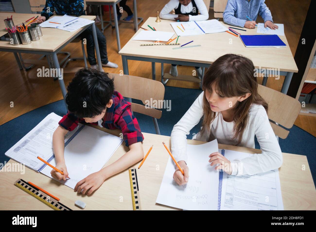 Student writing paper desk hi-res stock photography and images - Alamy
