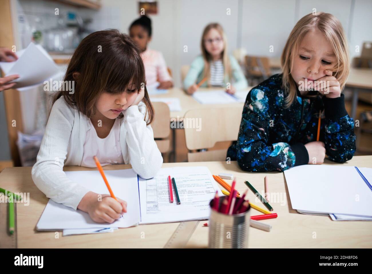 Student writing paper desk hi-res stock photography and images - Alamy