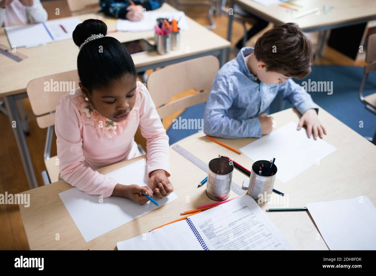 High angle view of students studying in classroom at school Stock Photo ...