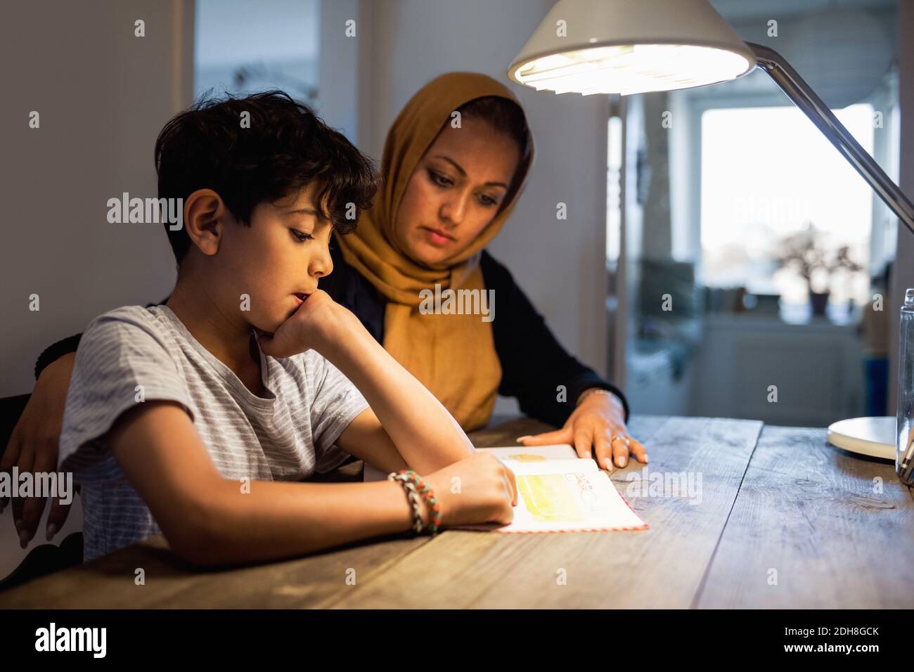 Book under table hi-res stock photography and images - Alamy