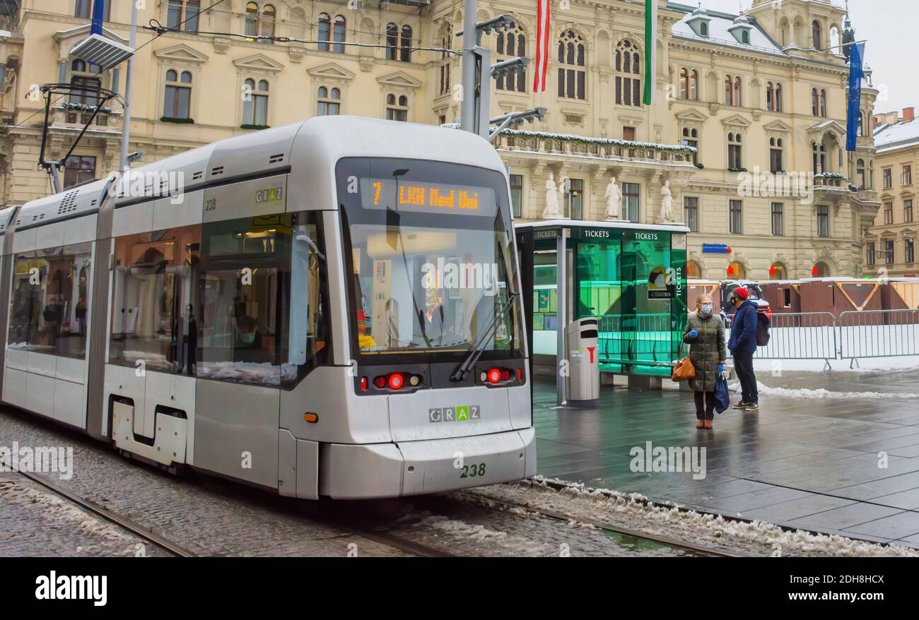 Graz, Austria-December 03, 2020: People in tram station at main square ...