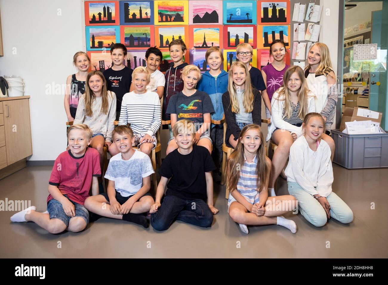 Portrait of happy school children in classroom Stock Photo - Alamy