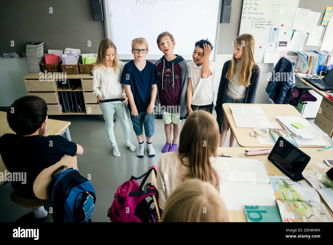 Child standing front desk hi-res stock photography and images - Alamy