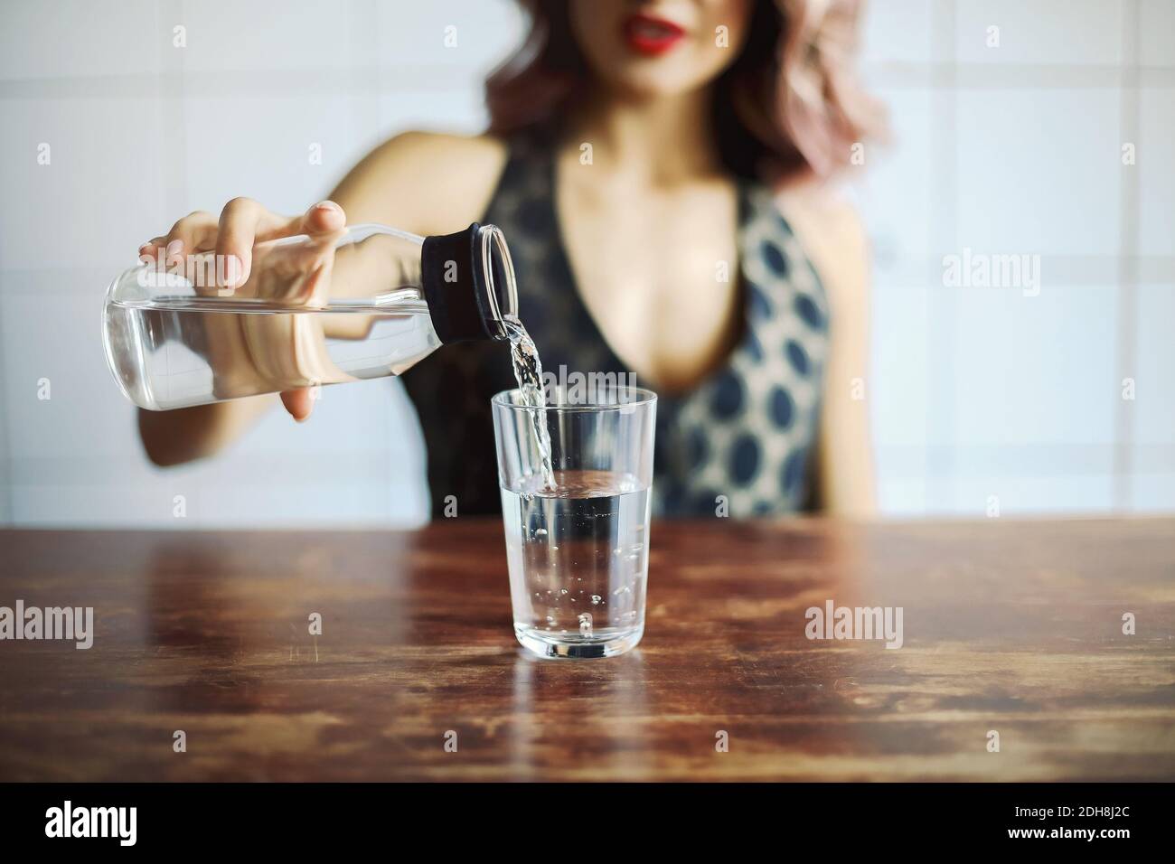 Woman pouring pure water glass hi-res stock photography and images - Alamy