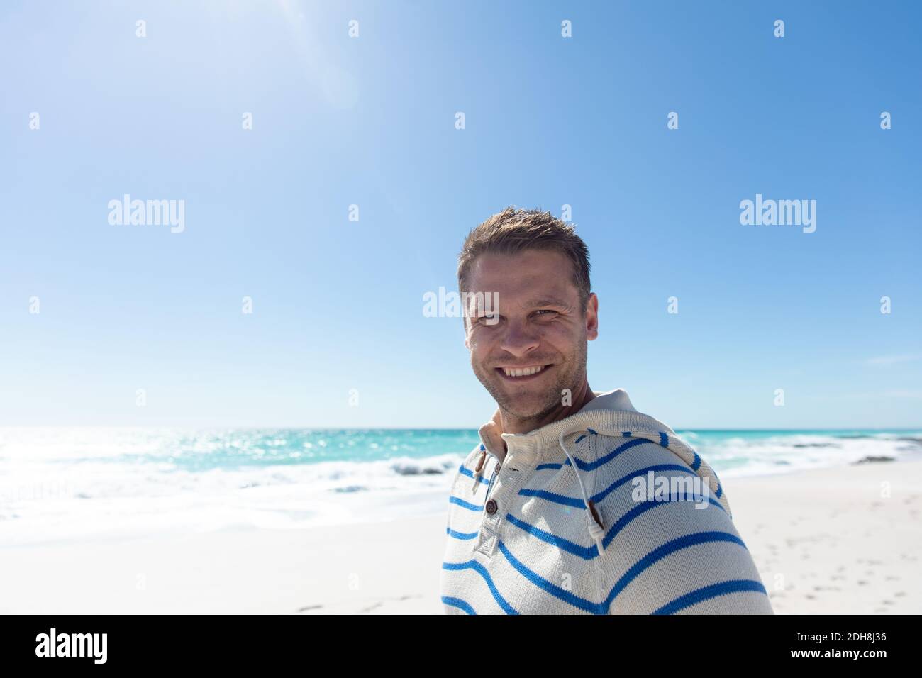 Man smiling at the beach Stock Photo - Alamy