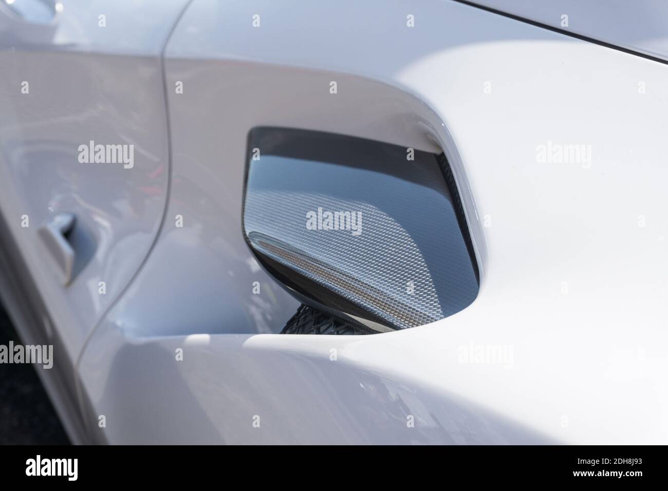 Close up detail of the carbon fibre insert on the side air intake of a ...