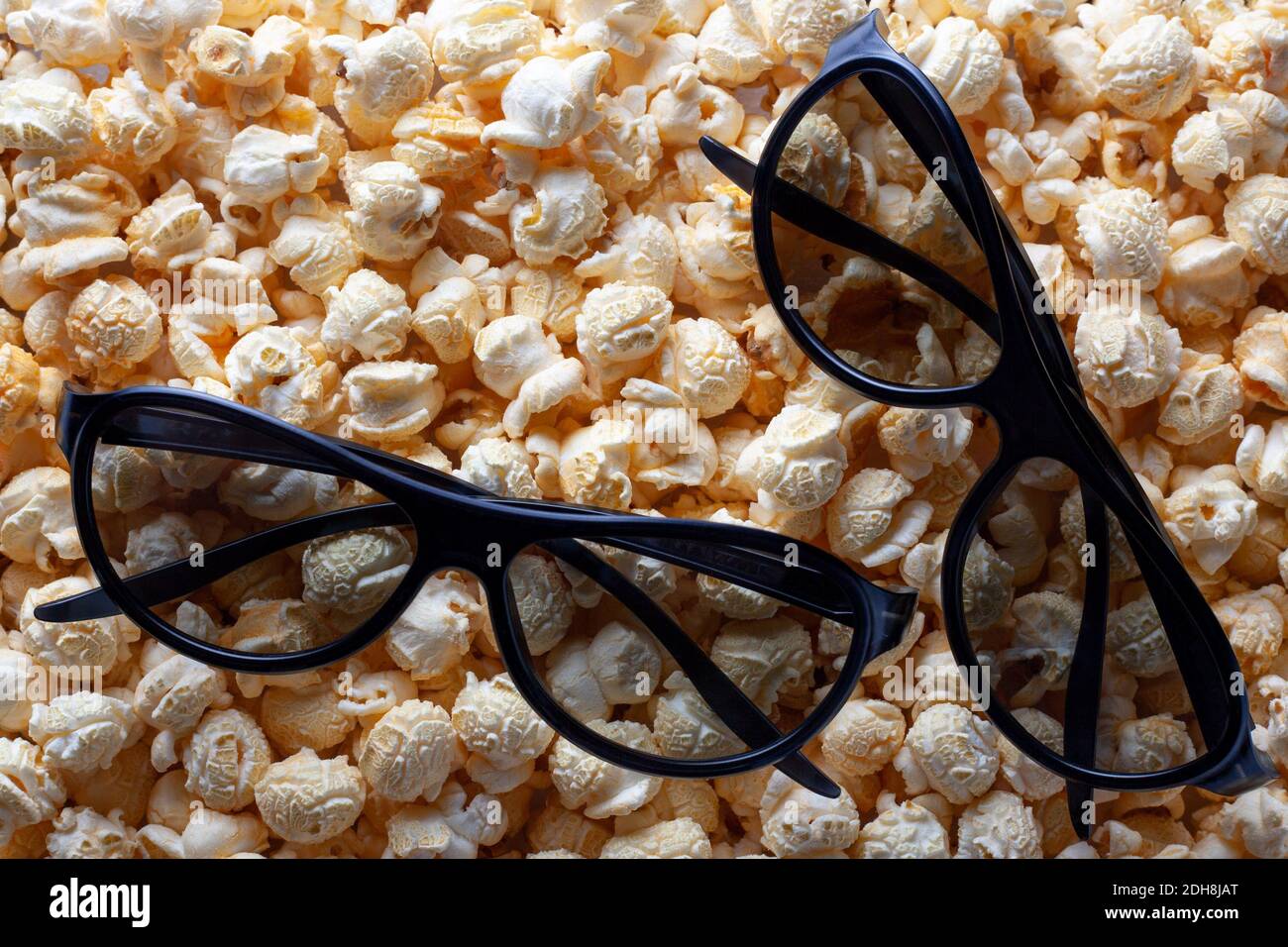 3 D glasses lie at cheesy popcorn background. Glasses for 3D movie ...