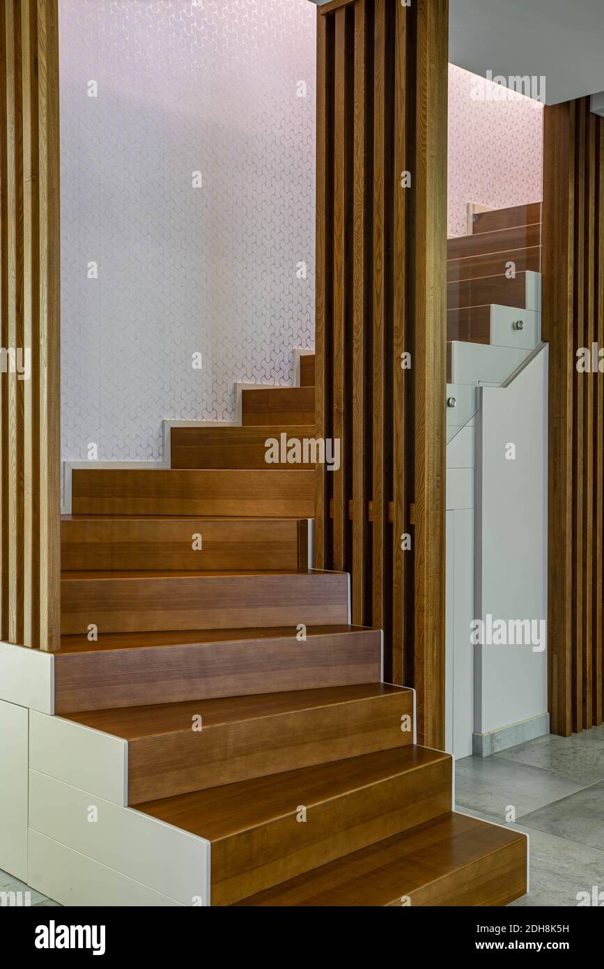 Wooden staircase in luxury apartment. Modern interior of flat Stock ...