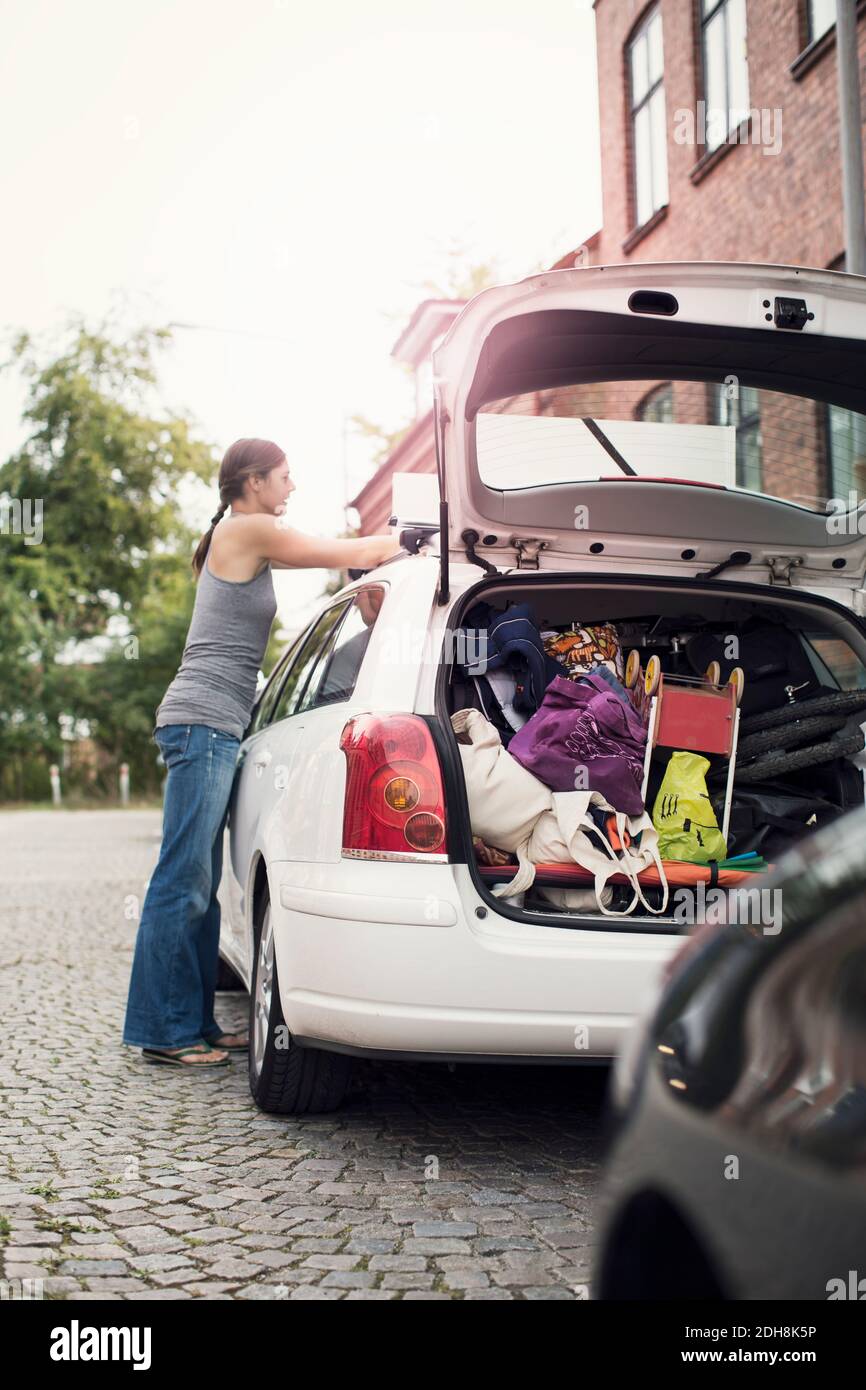 Woman loading cars hi-res stock photography and images - Alamy