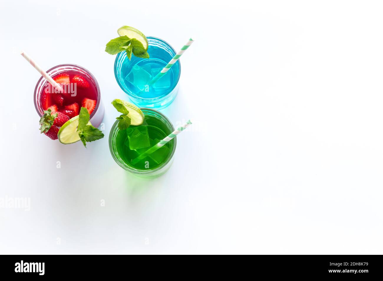 Cold green, blue and red cocktails with fresh fruits and mint Stock ...