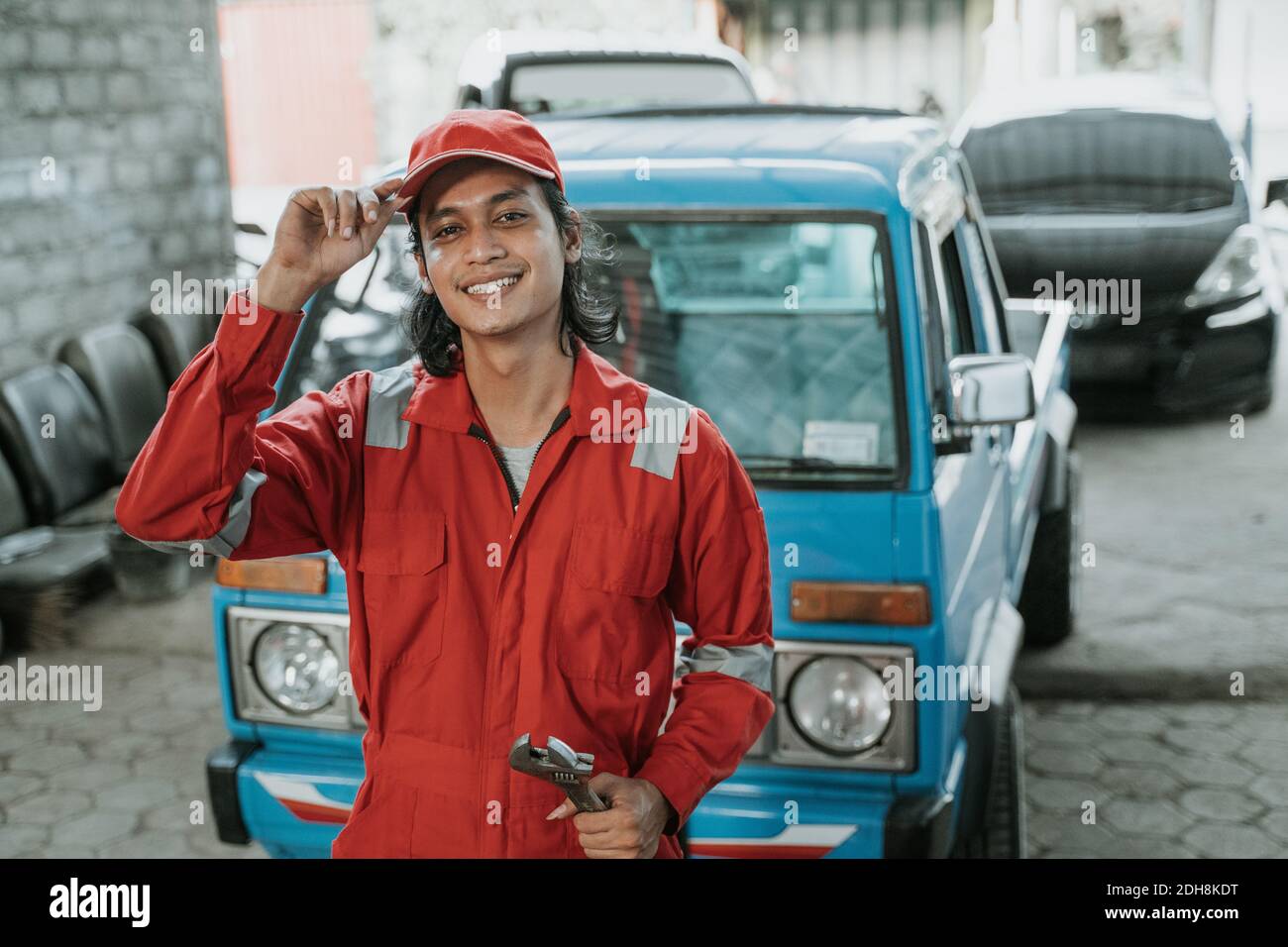 portrait of mechanic carry tools in his hand in his workshop Stock ...