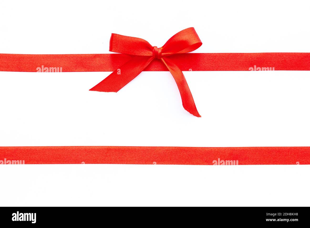 Red ribbon with bow for holiday gift box or greeting card banner. Top ...