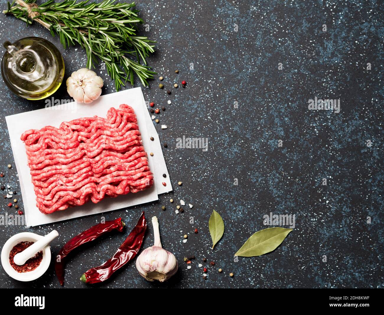 Raw minced beef on light gray cement background Stock Photo - Alamy