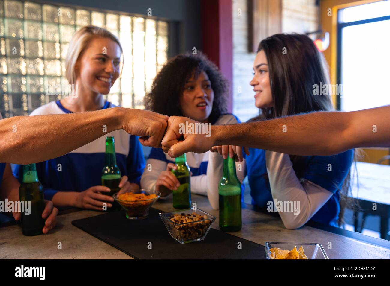 Supporters talking together in a bar Stock Photo - Alamy