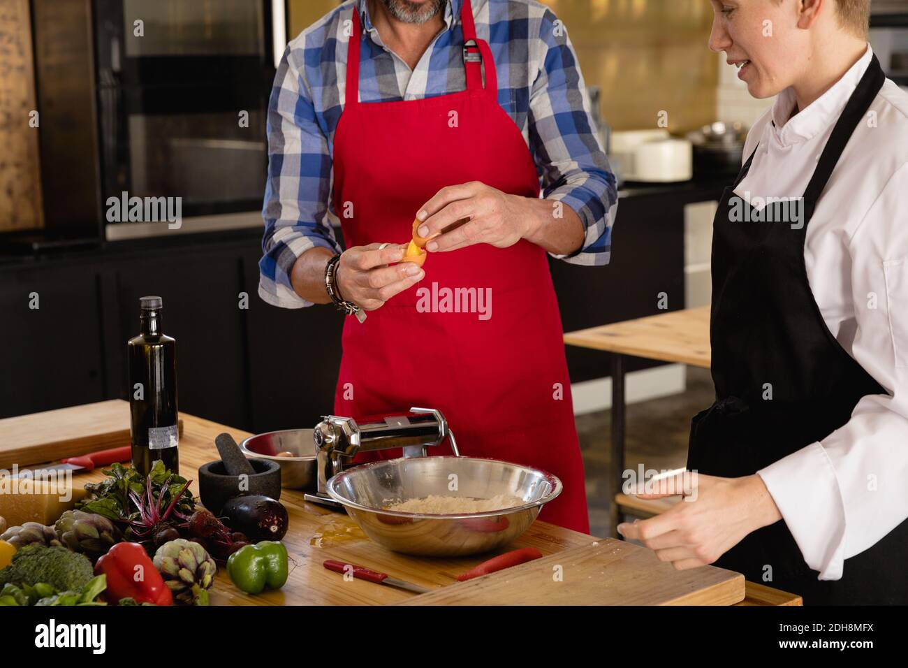 Chefs cooking together Stock Photo - Alamy