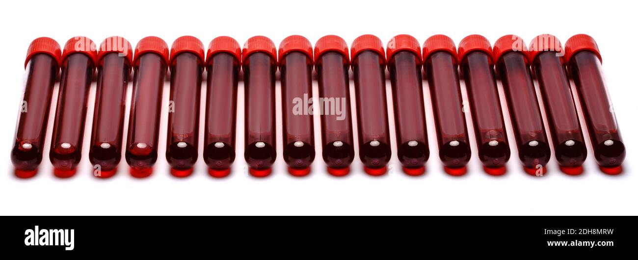 Test tubes with red plug isolated on white background Stock Photo - Alamy
