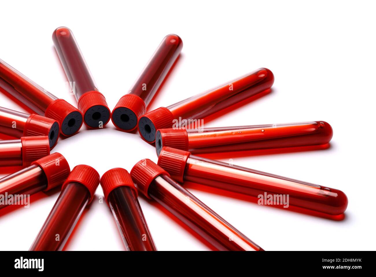 Test tubes with red plug isolated on white background Stock Photo - Alamy