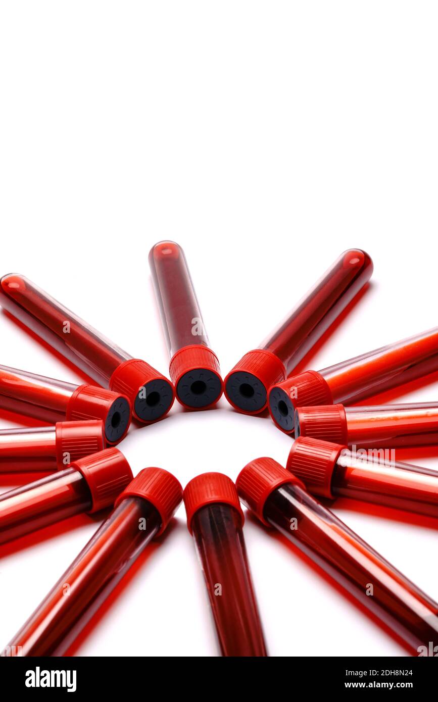 Test tubes with red plug isolated on white background Stock Photo - Alamy