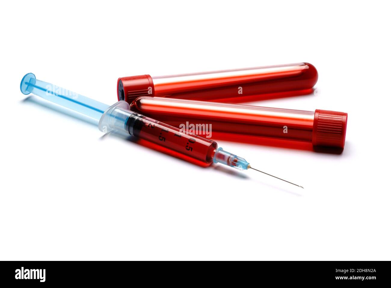 Medical syringe and plastic test tube isolated on white background ...