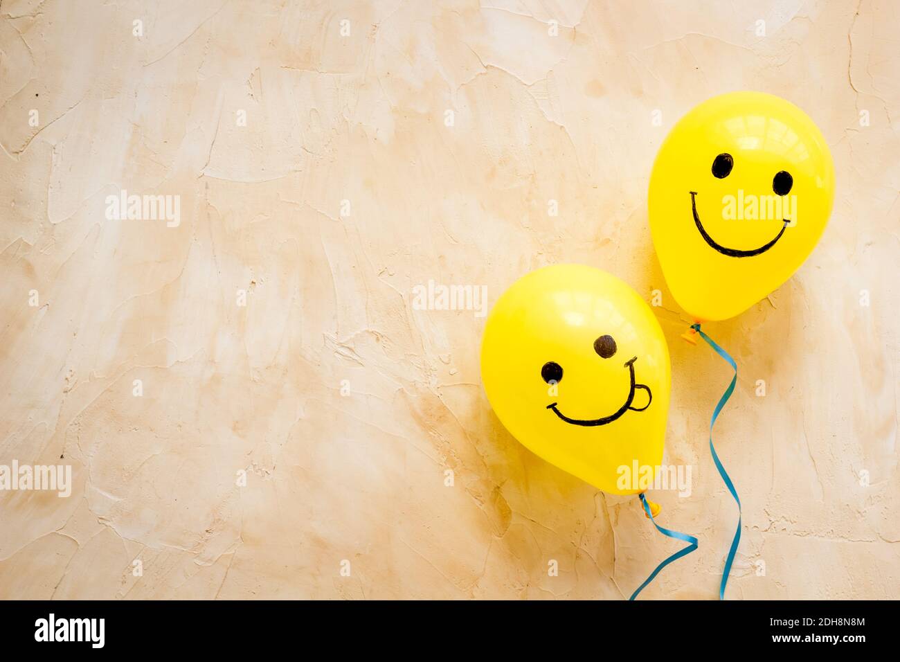 Positive emotions set. Happy and winking emoticons painted on colored ...