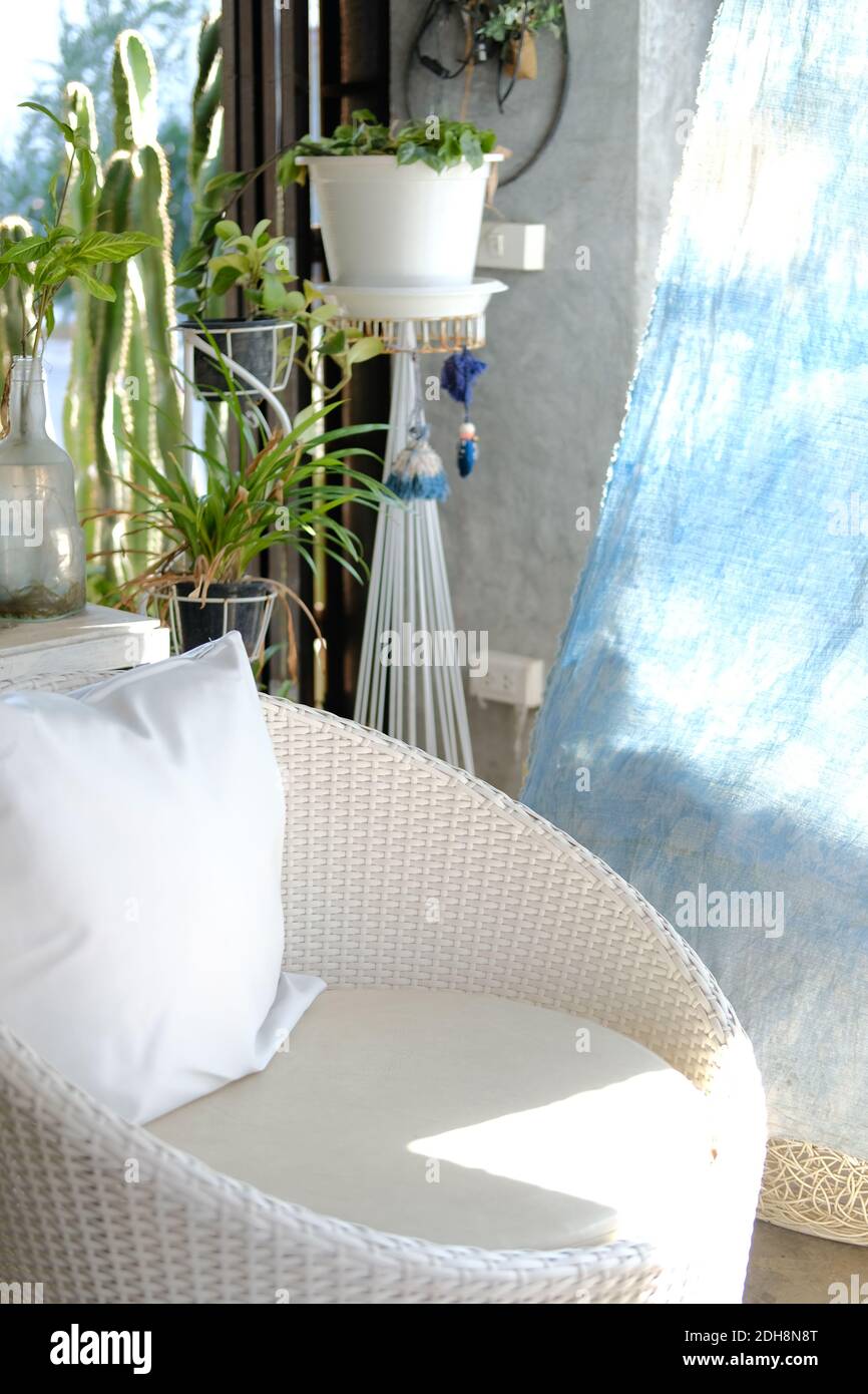 white wicker rattan chair sofa seat on patio at home Stock Photo - Alamy