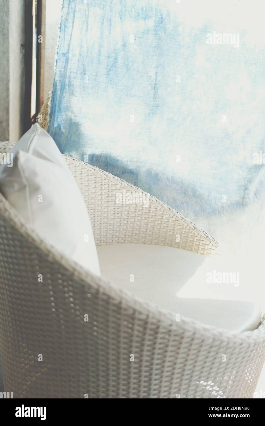white wicker rattan chair sofa seat on patio at home Stock Photo - Alamy