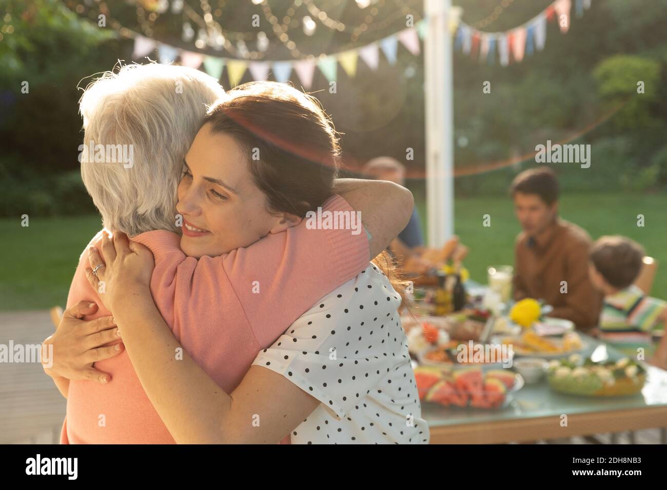 Family eating outside together in summer Stock Photo - Alamy