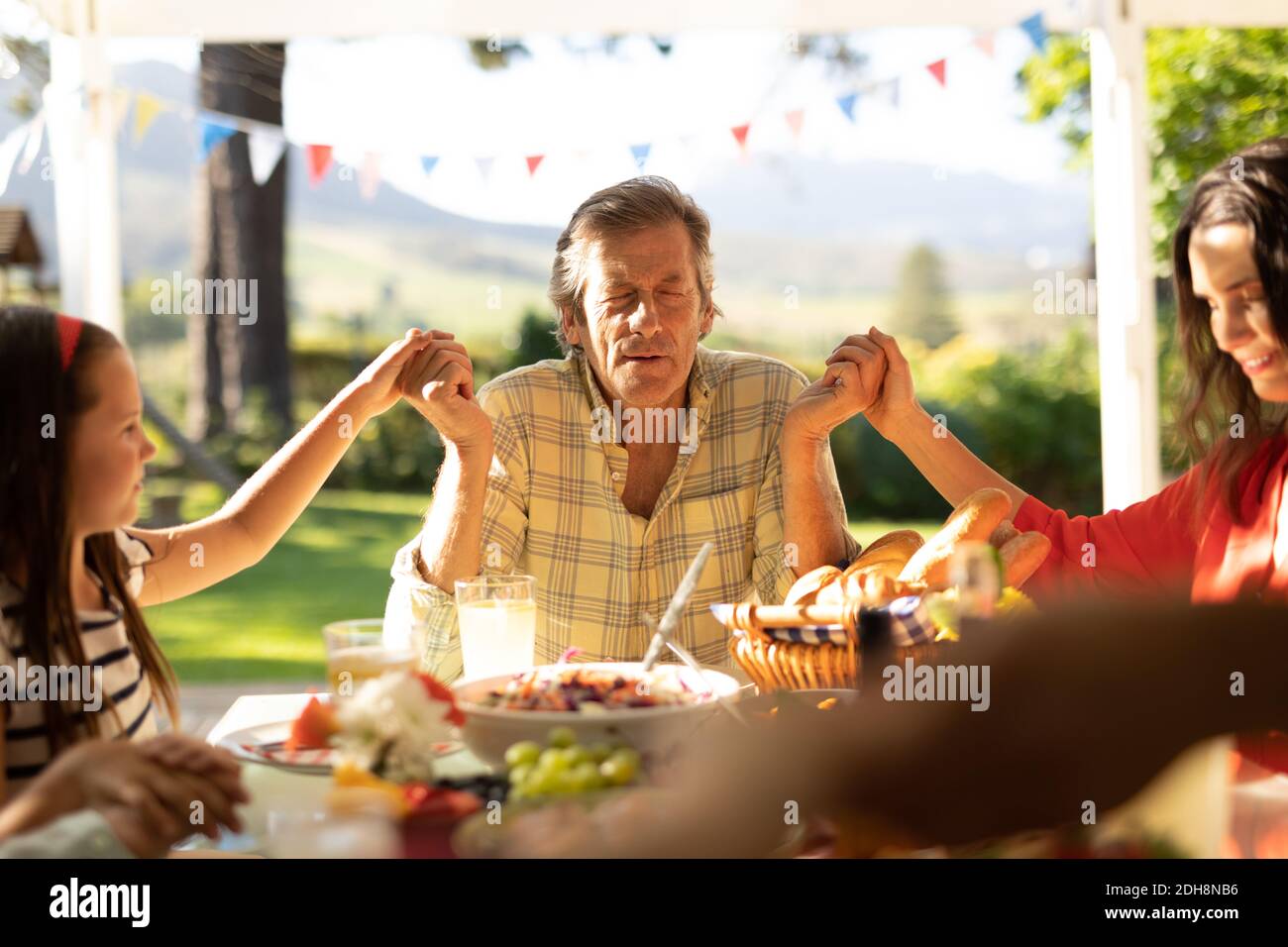 Family meal outside hands hi-res stock photography and images - Alamy