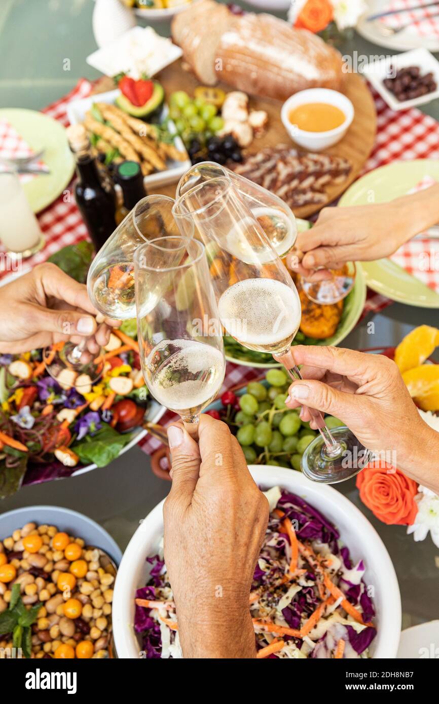 Family eating outside together in summer Stock Photo - Alamy