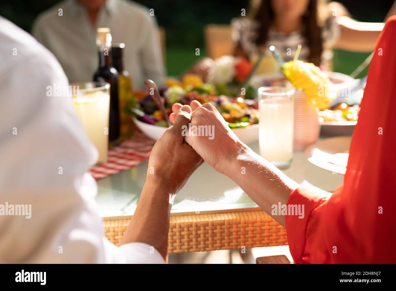 Family eating outside together in summer Stock Photo - Alamy
