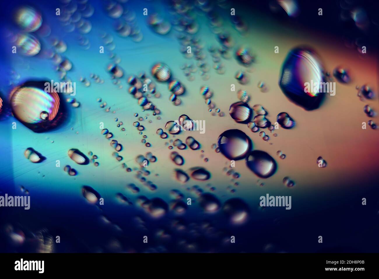 Beautiful multi colored water drop of holographic effect. Background ...
